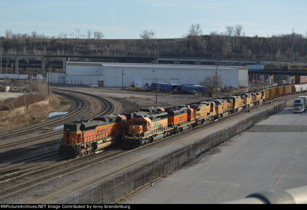 BNSF 1728 bringing a eastbound transfer past the dpu's of a ogex coal load at santa fe jct